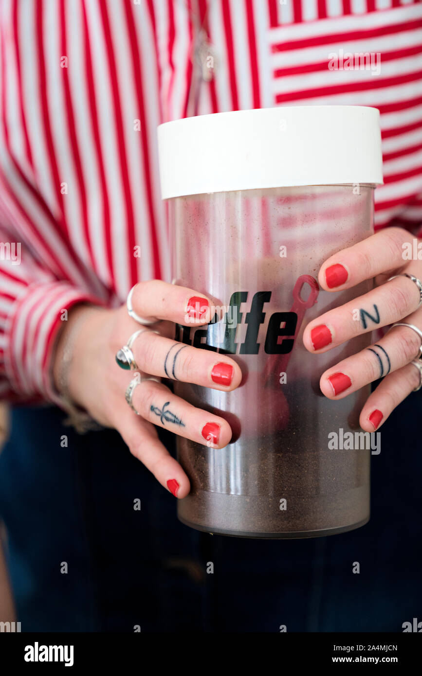 Hands with coffee jar Stock Photo - Alamy