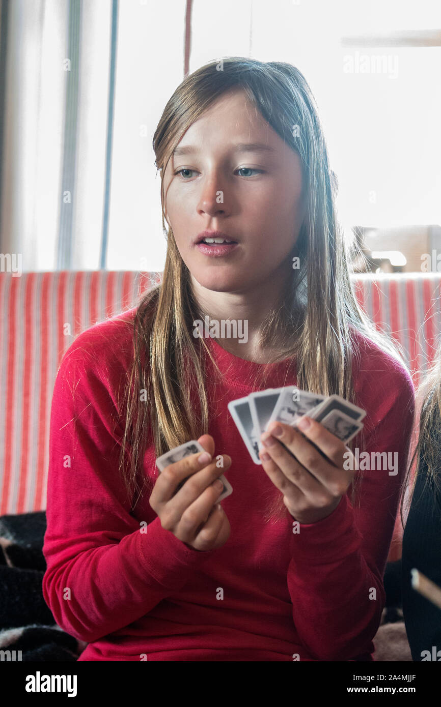 Girl playing cards Stock Photo - Alamy