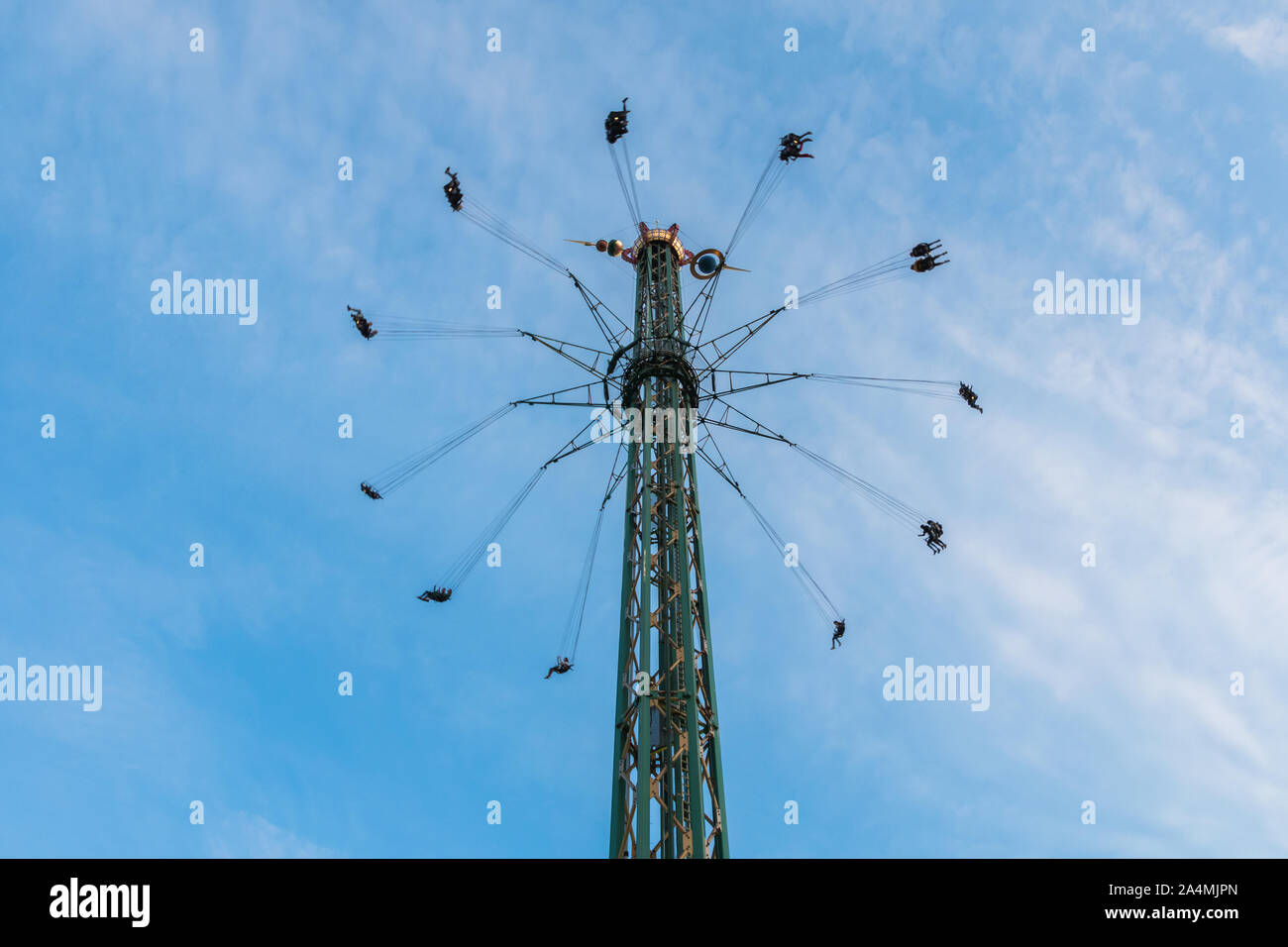 Amusement Park Carousel at the top with a blue sky in background. Fun ...