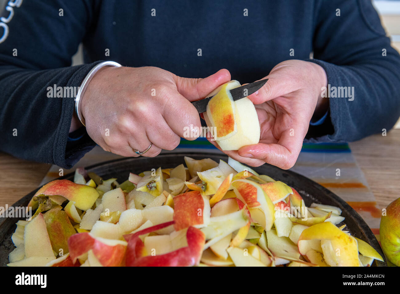 Woman peeling apples hi-res stock photography and images - Alamy