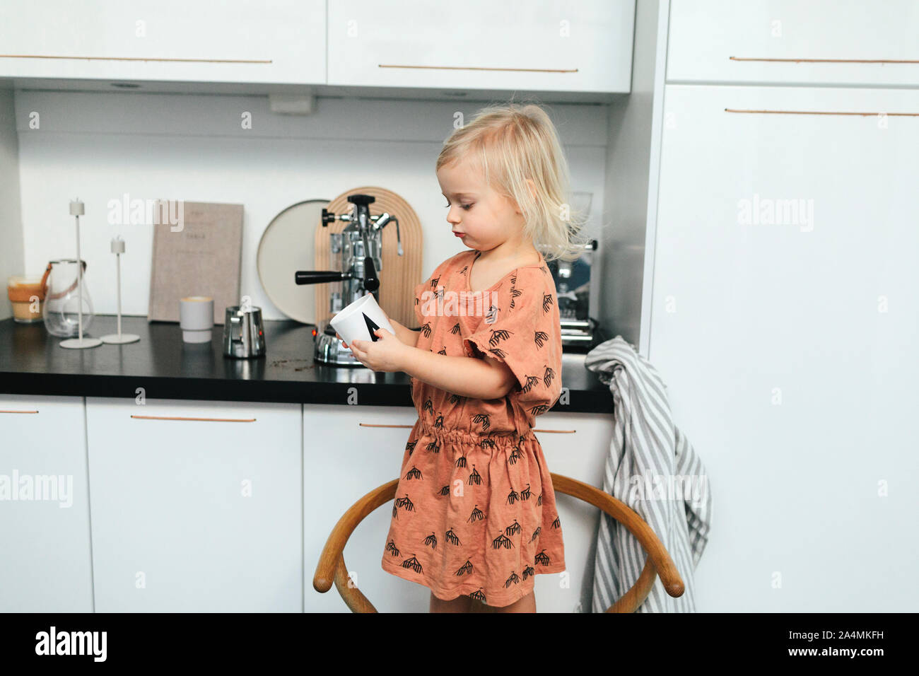 Girl in kitchen Stock Photo - Alamy