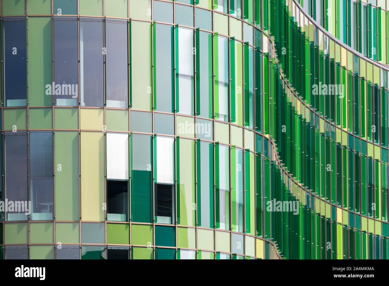 Perspective of the facade of a modern office building with cool green ...