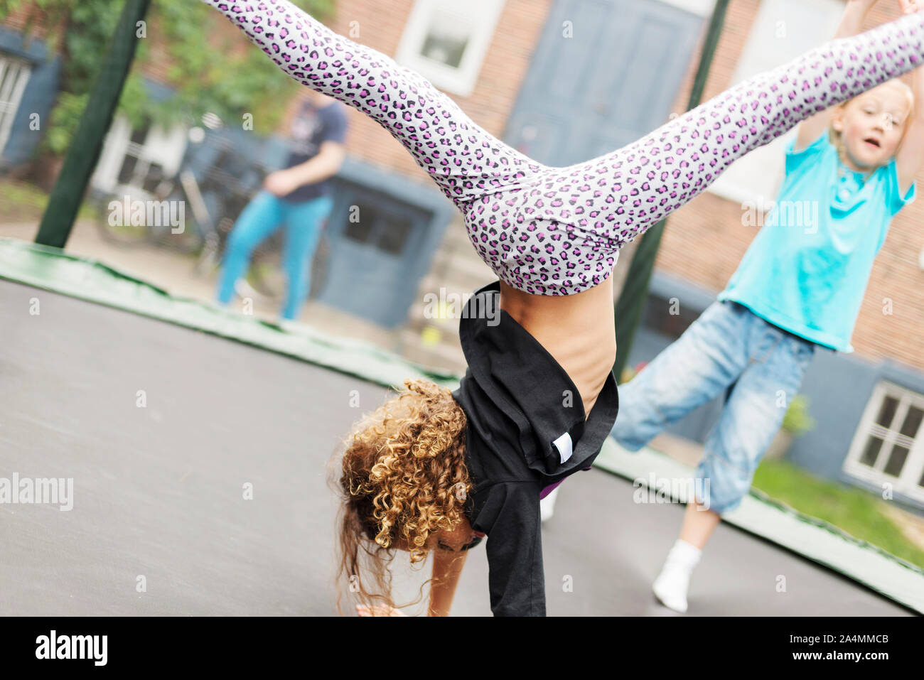 Girl doing handstand hi-res stock photography and images - Alamy