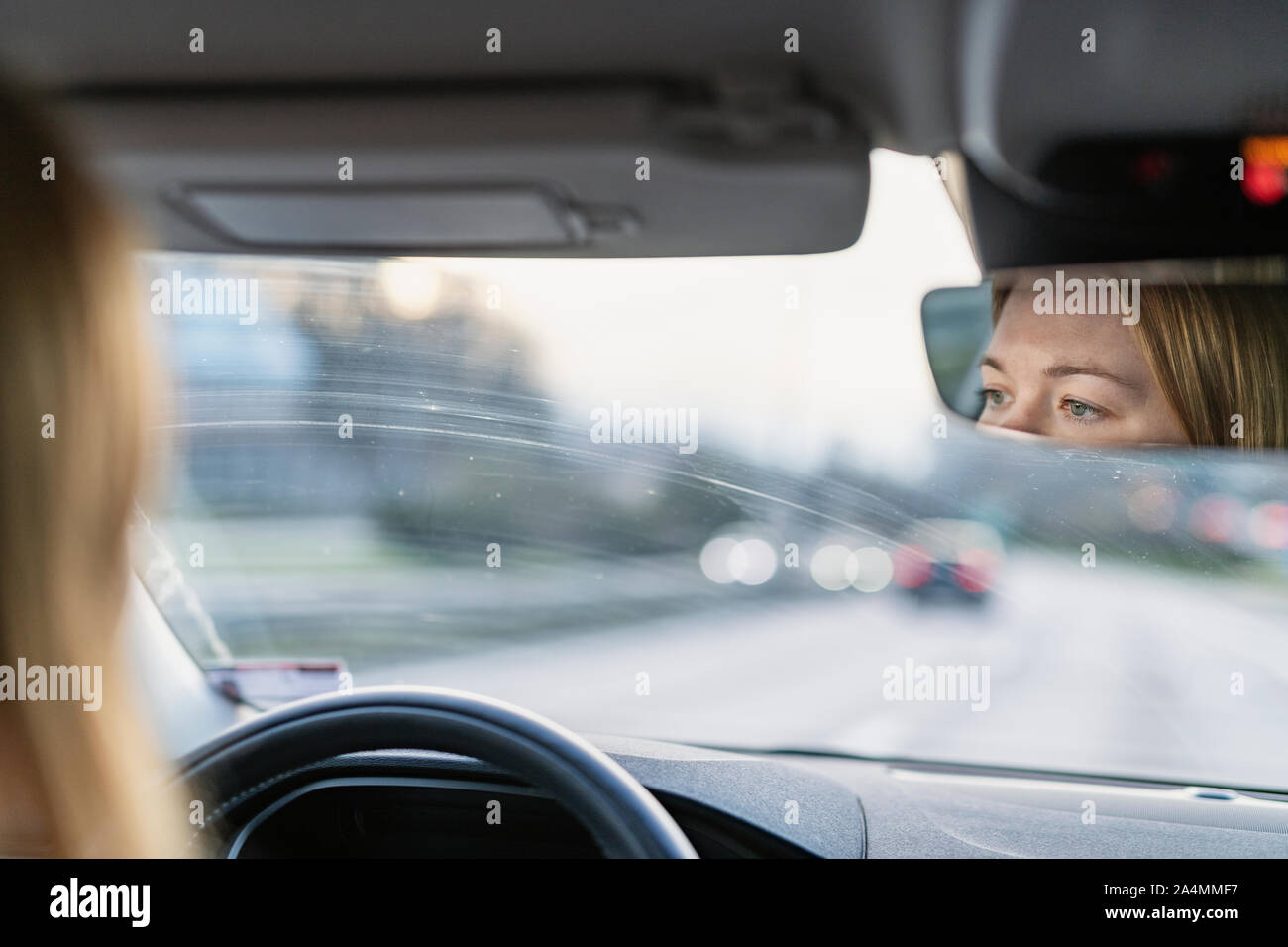 Young woman driving Stock Photo - Alamy