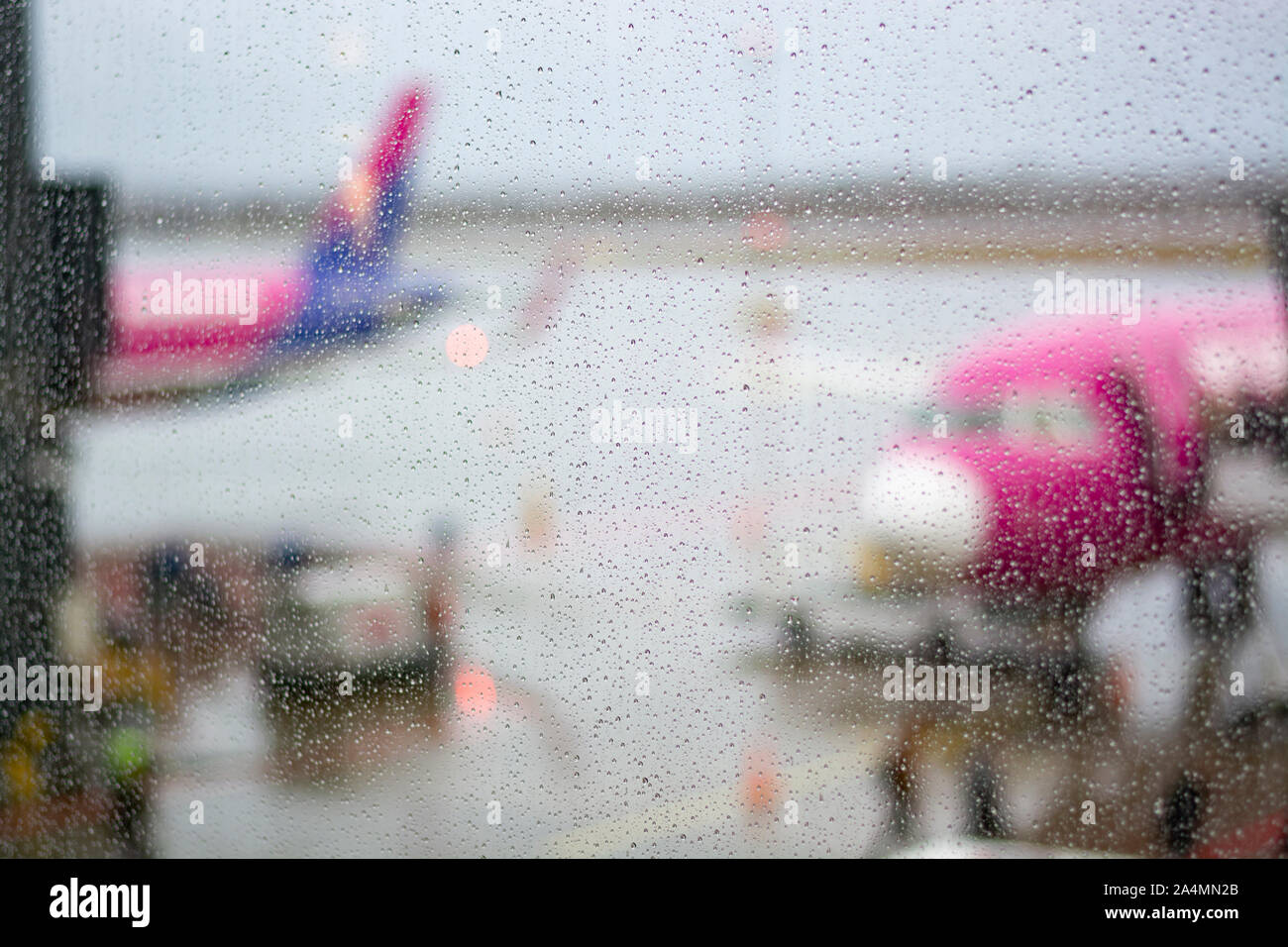 Travel in bad weather conditions concept background with water drops on ...