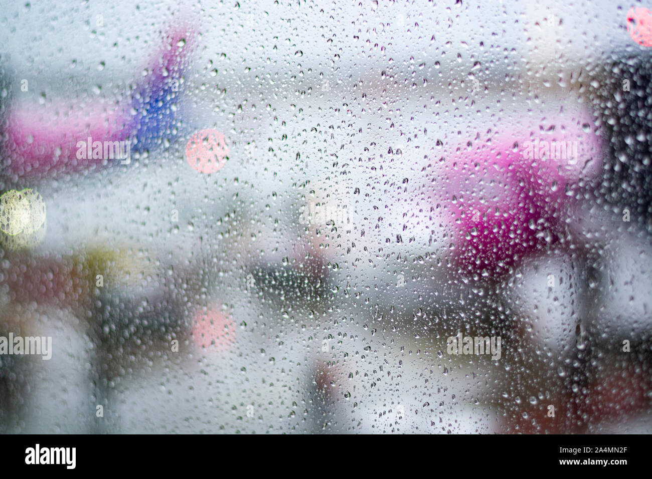 Travel in bad weather conditions concept background with water drops on ...