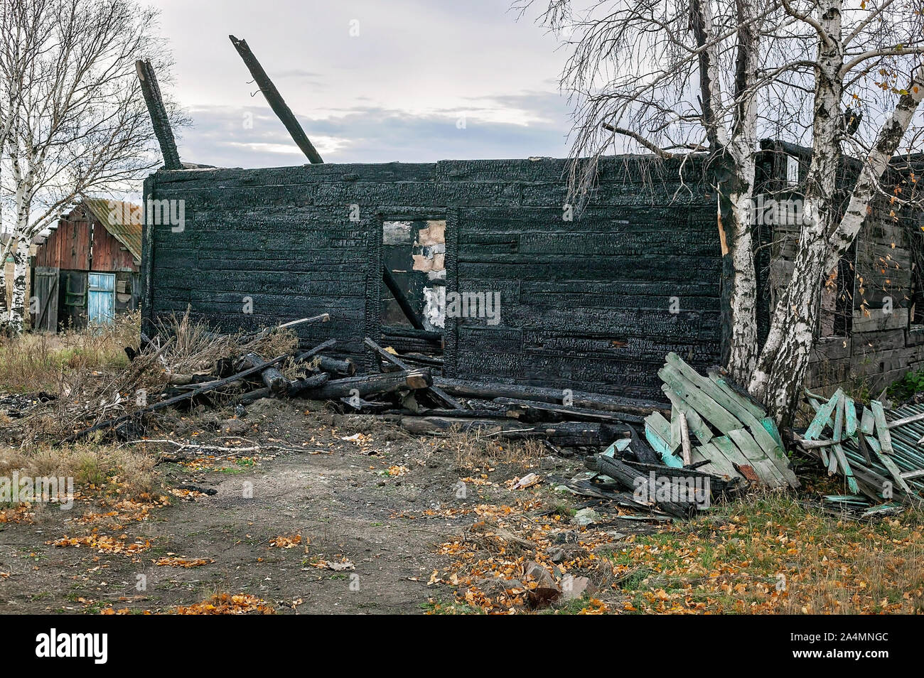 Burnt wooden house. Destroyed roof and windows, charred walls Stock ...