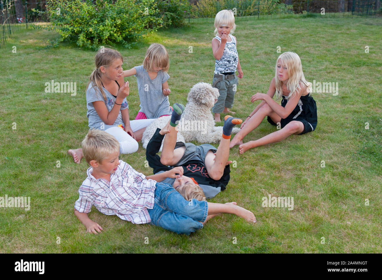 Sisters girls sitting on lawn hi-res stock photography and images - Alamy