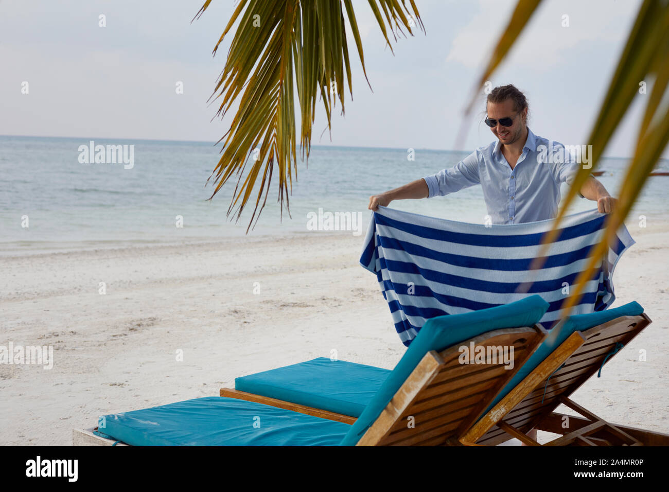 Man on beach Stock Photo - Alamy