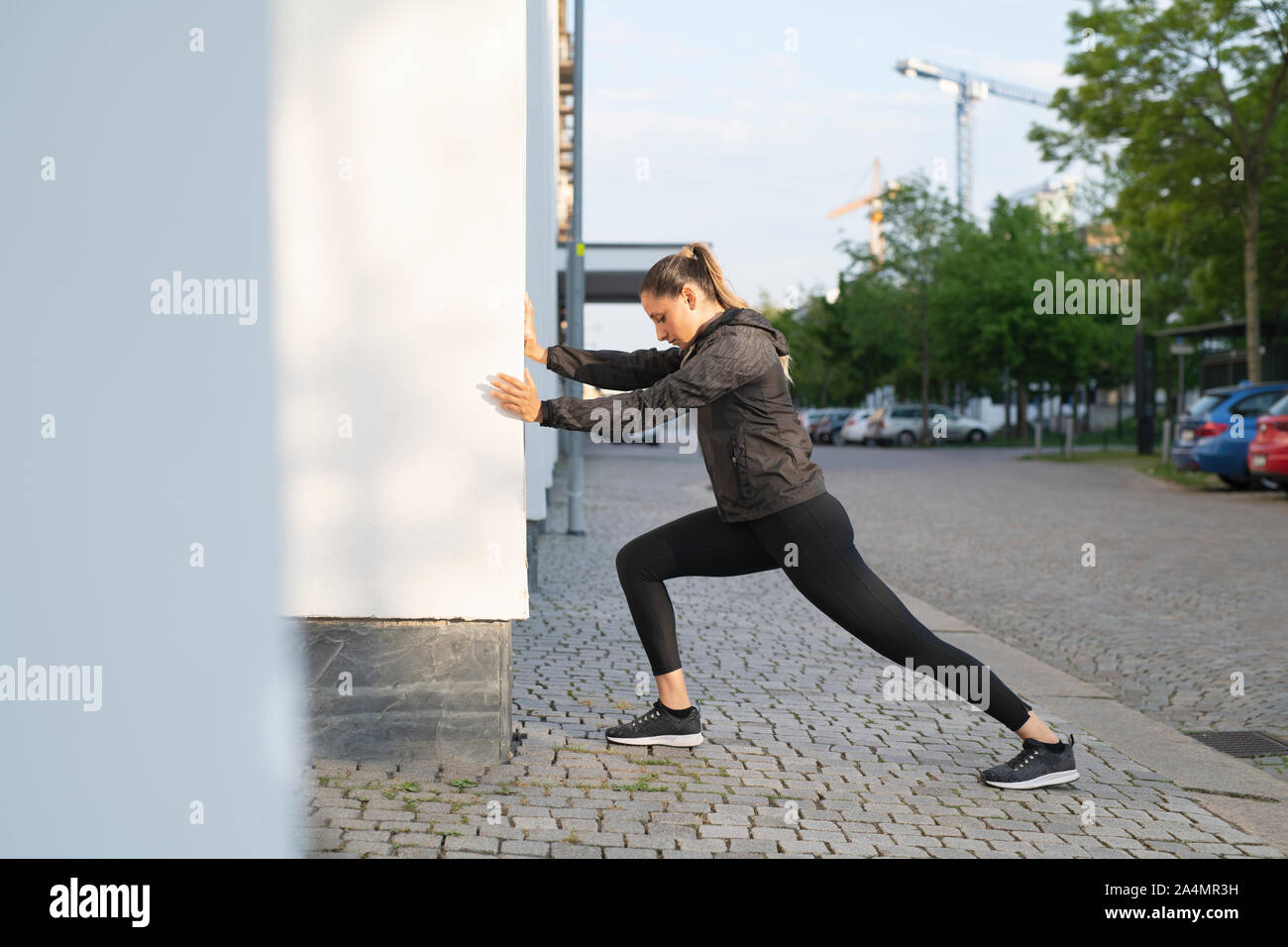 Caucasian woman exercising stretching hi-res stock photography and ...