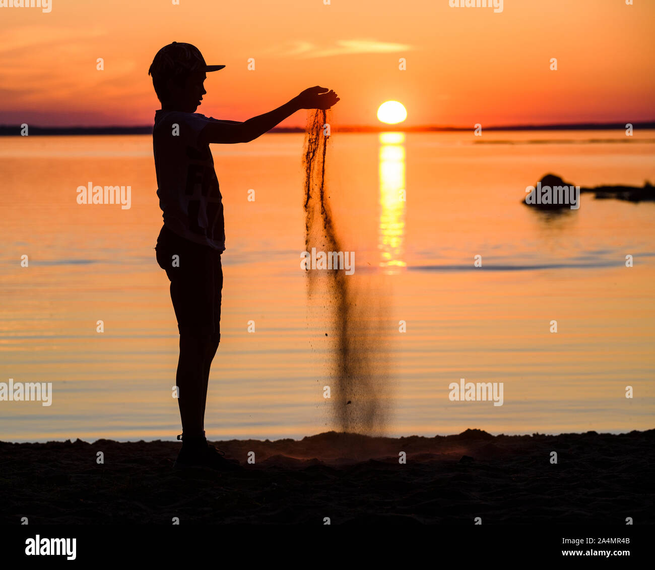 Boy playing on beach Stock Photo - Alamy
