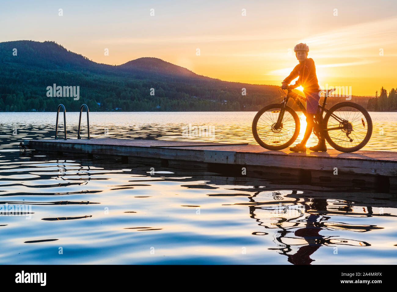 Boy on jetty hi-res stock photography and images - Alamy