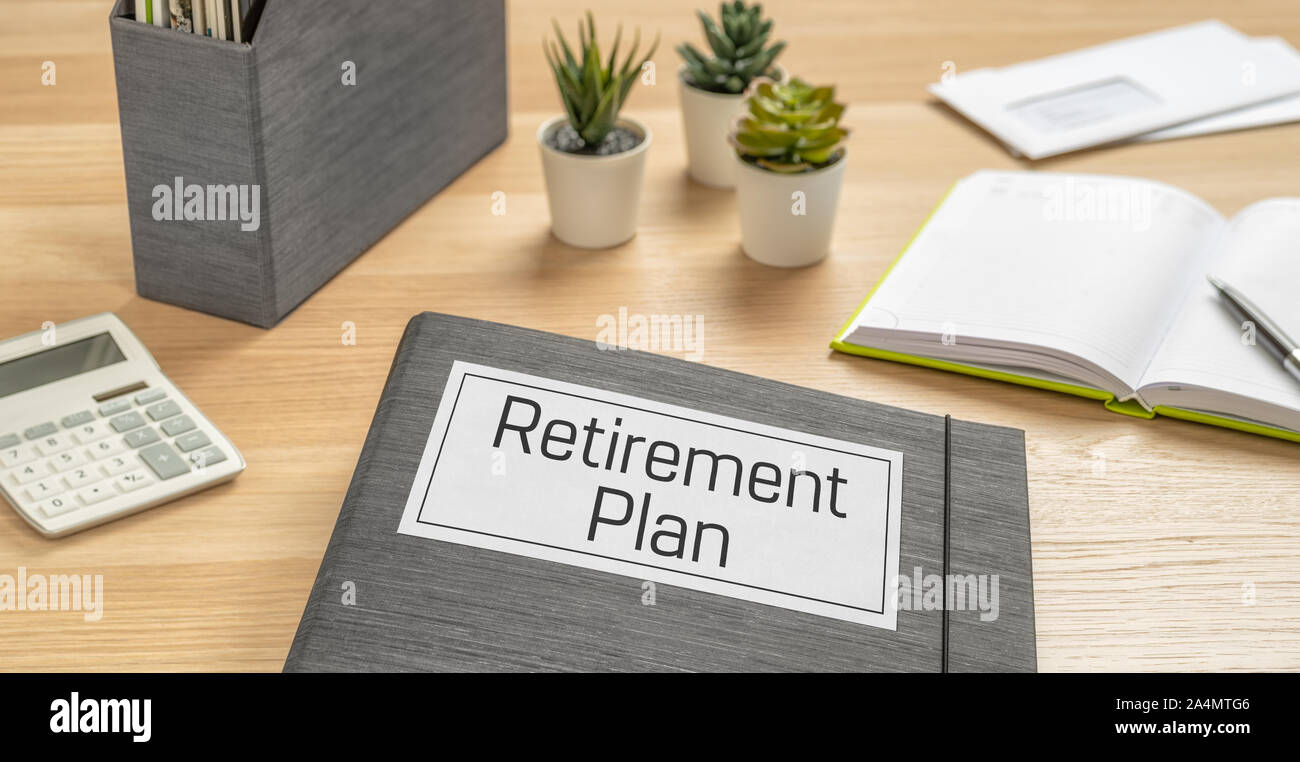 A folder on a desk with the label Retirement Plan Stock Photo - Alamy