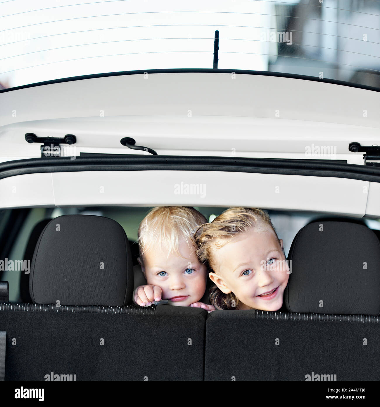 Brother and sister in car Stock Photo - Alamy