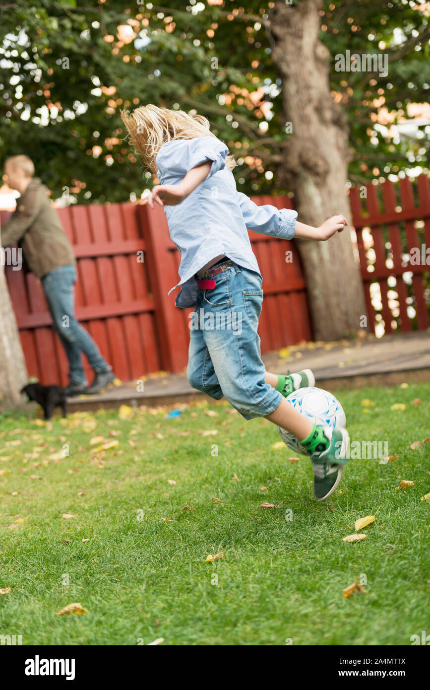 Boy playing soccer Stock Photo - Alamy