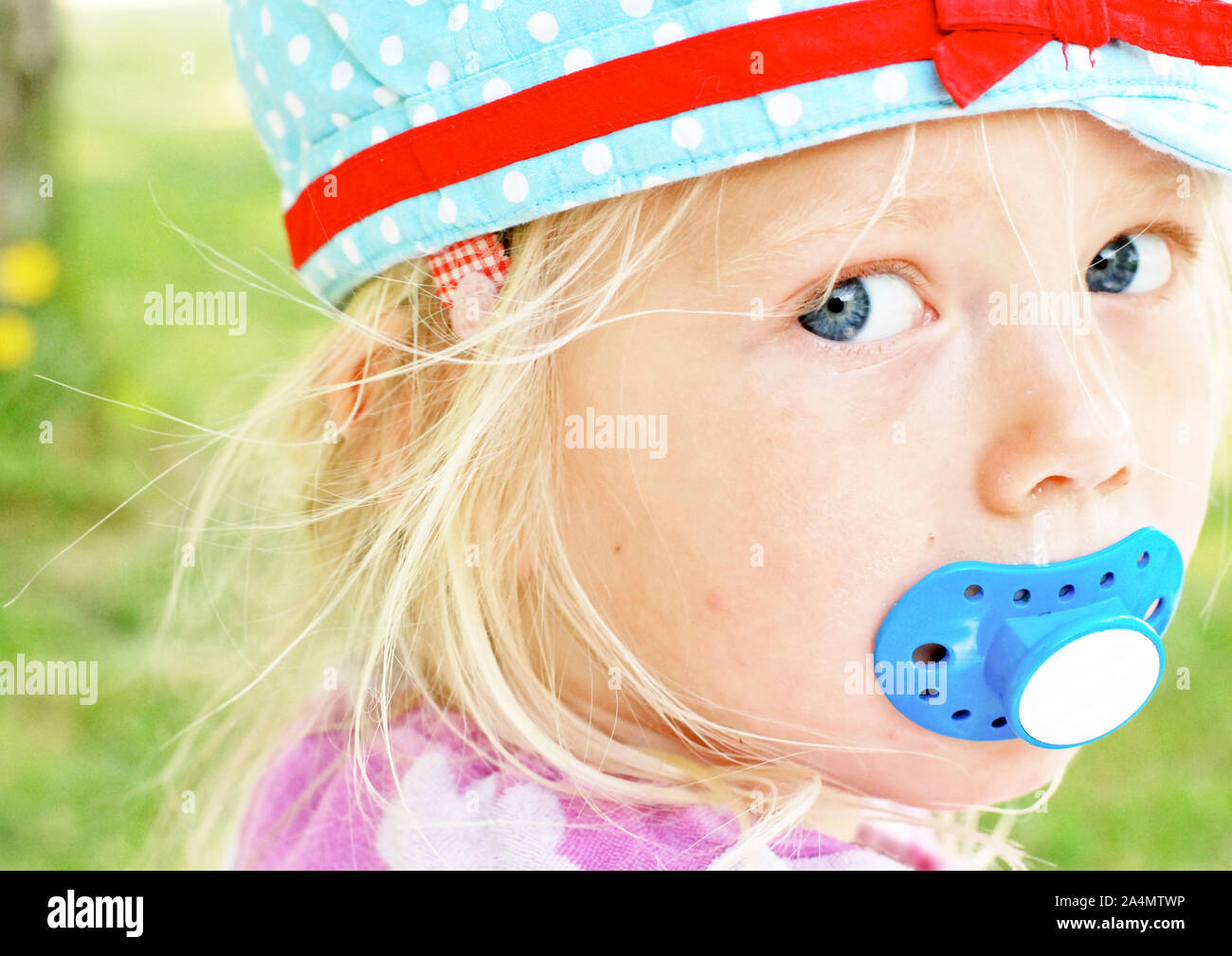 Portrait of girl with pacifier Stock Photo - Alamy