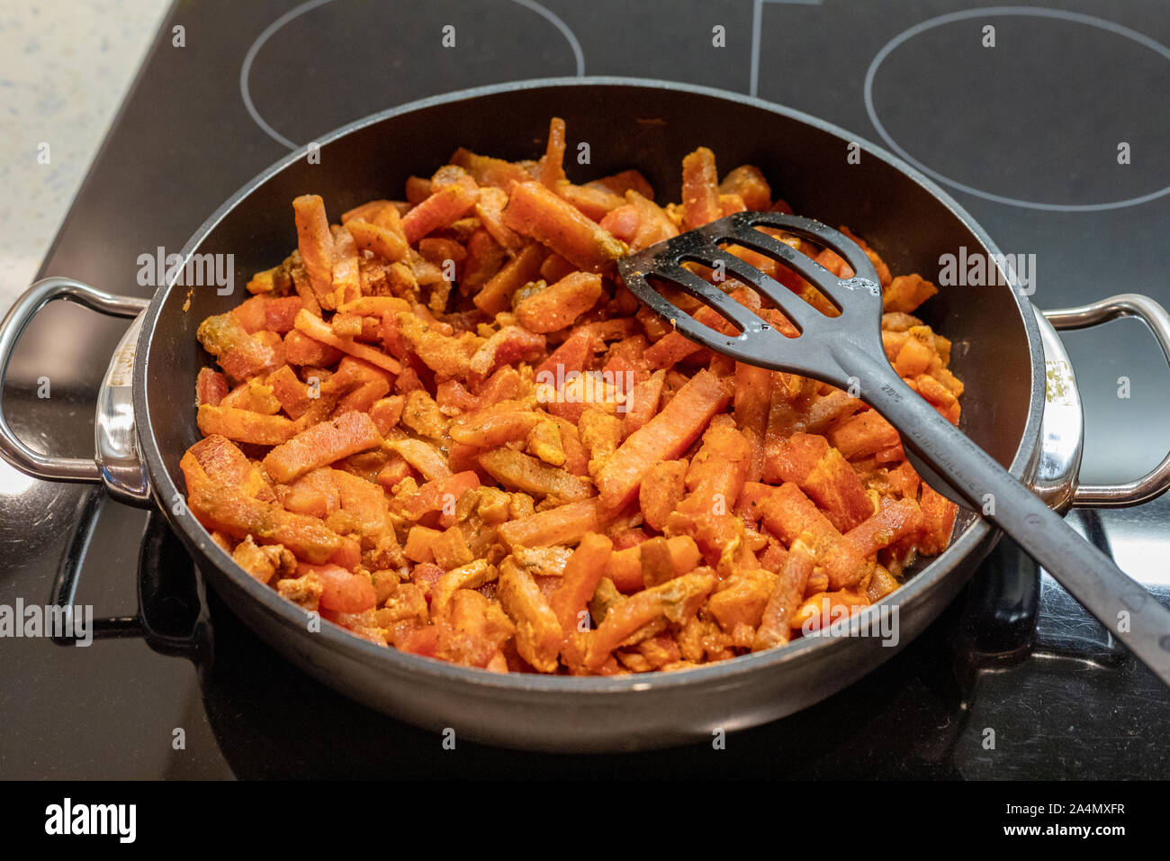 Frying gyros in a pan Stock Photo - Alamy