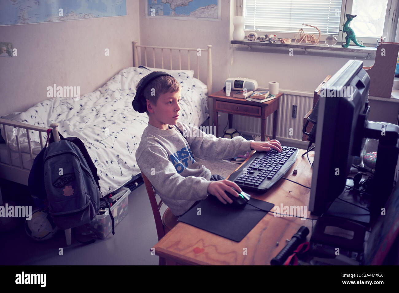 Boy using computer Stock Photo - Alamy