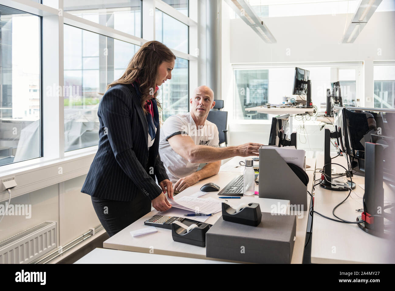 Coworkers in office Stock Photo - Alamy