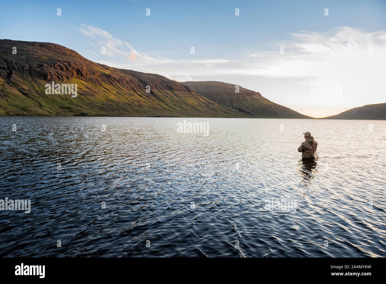 Man fishing in lake Stock Photo - Alamy