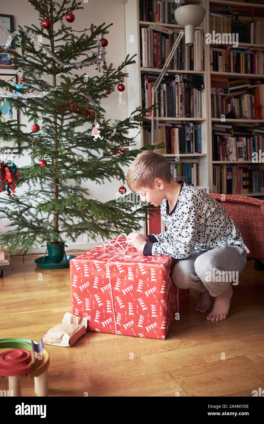 Boy opening present hi-res stock photography and images - Alamy