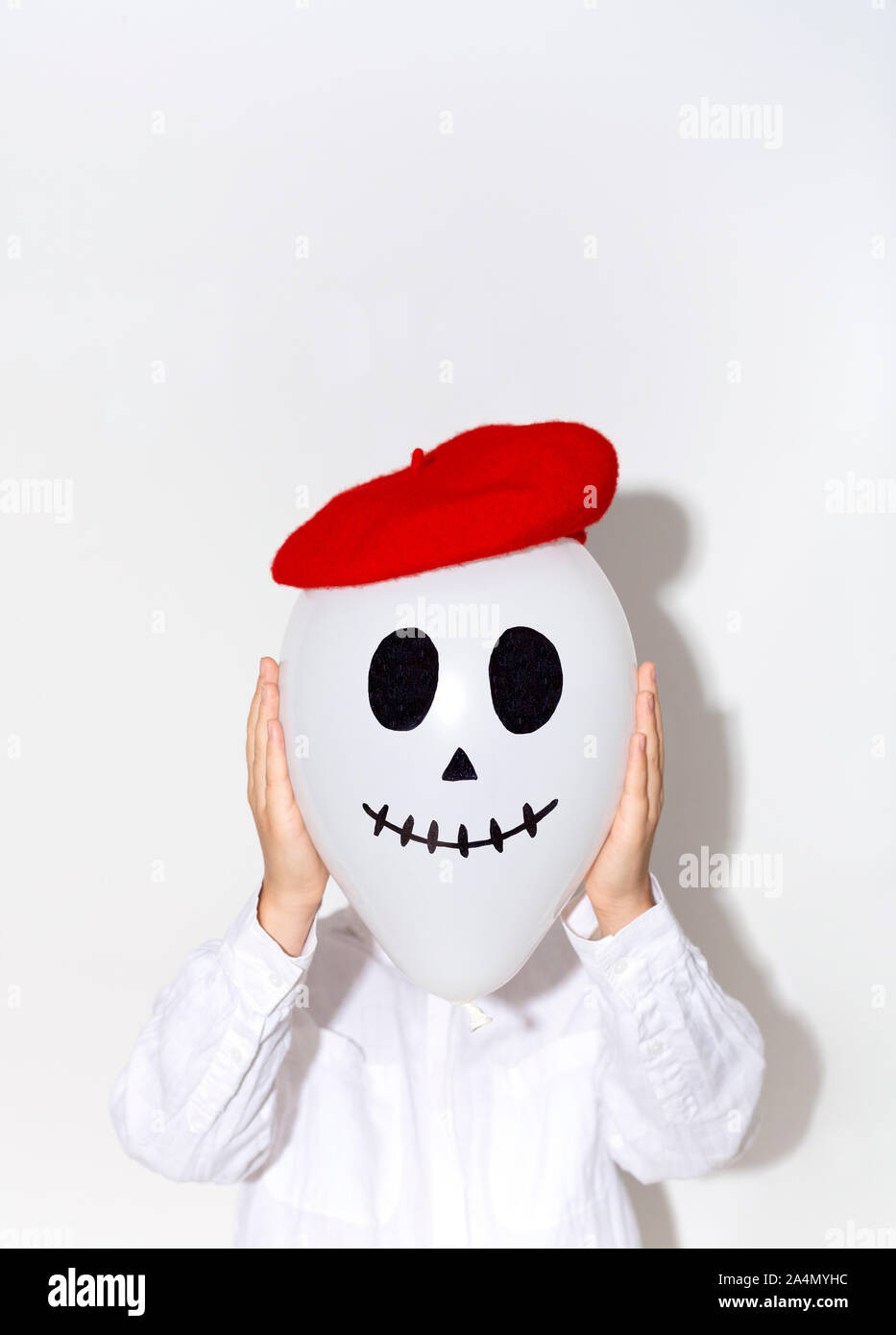 Funny and creative Halloween balloon in red beret Stock Photo - Alamy