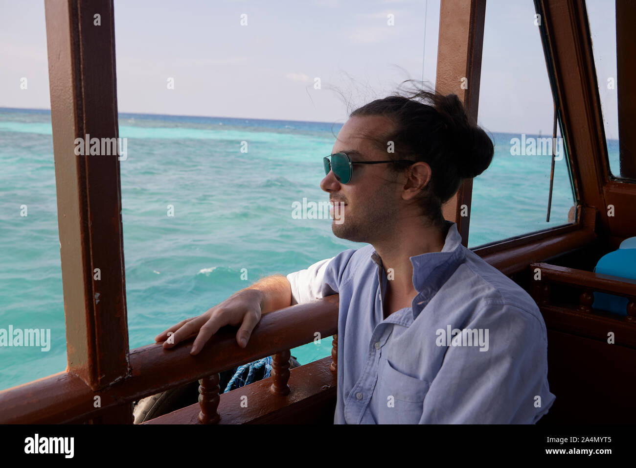 Man on boat Stock Photo - Alamy