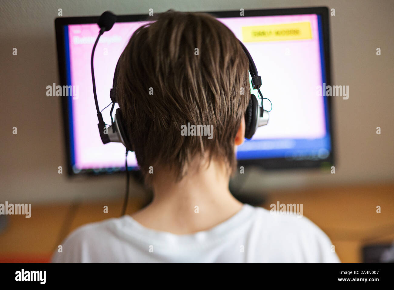 Boy using computer Stock Photo - Alamy