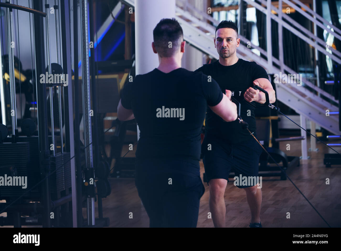 Man training in gym Stock Photo - Alamy
