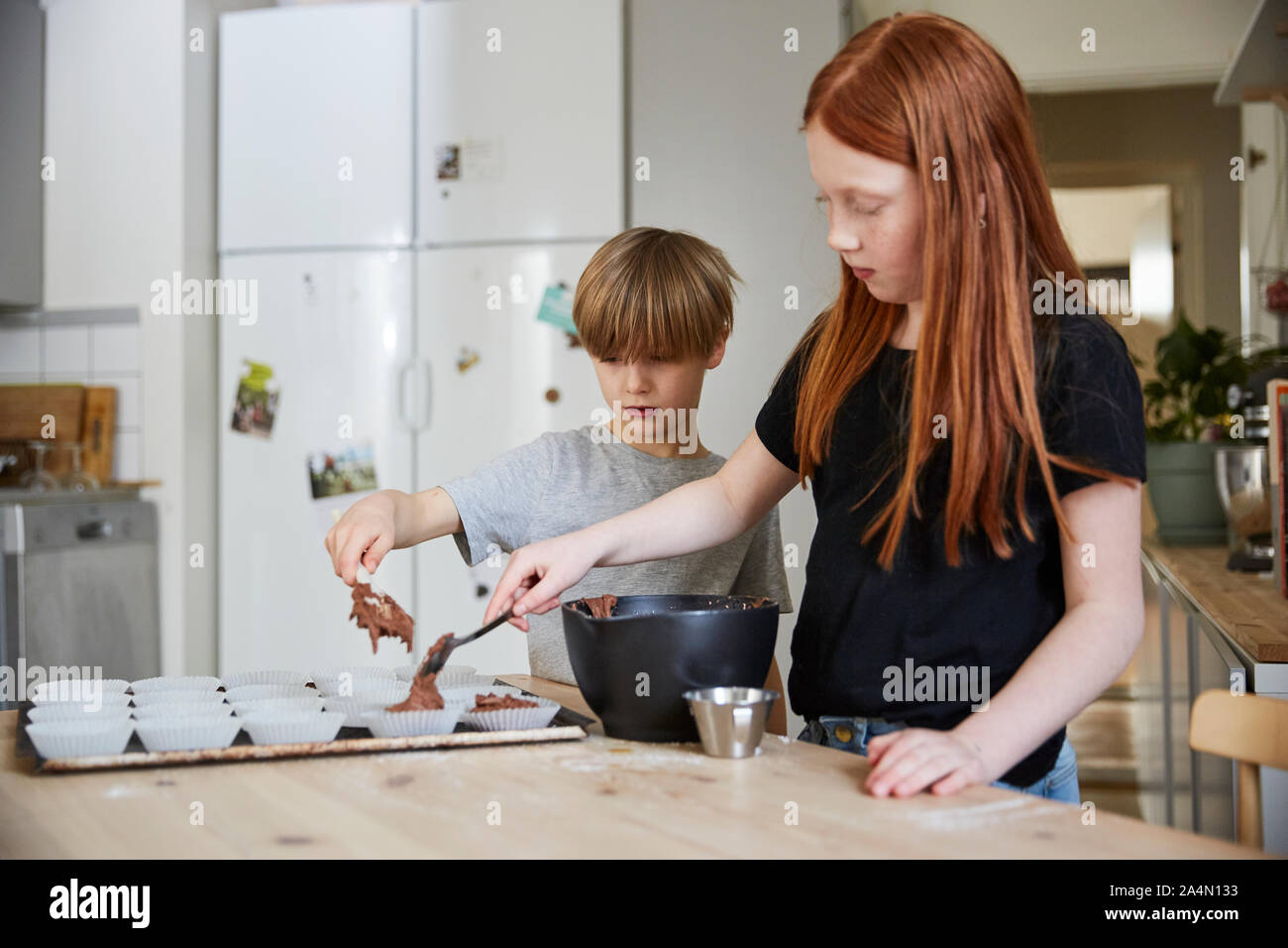 Brother and sister baking Stock Photo - Alamy
