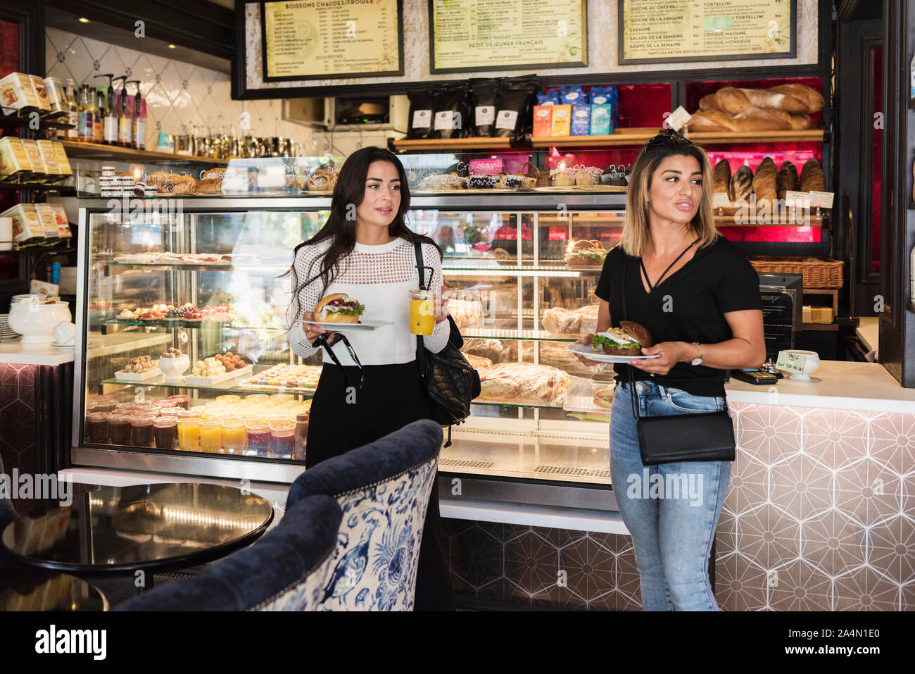 Young women in cafe Stock Photo - Alamy