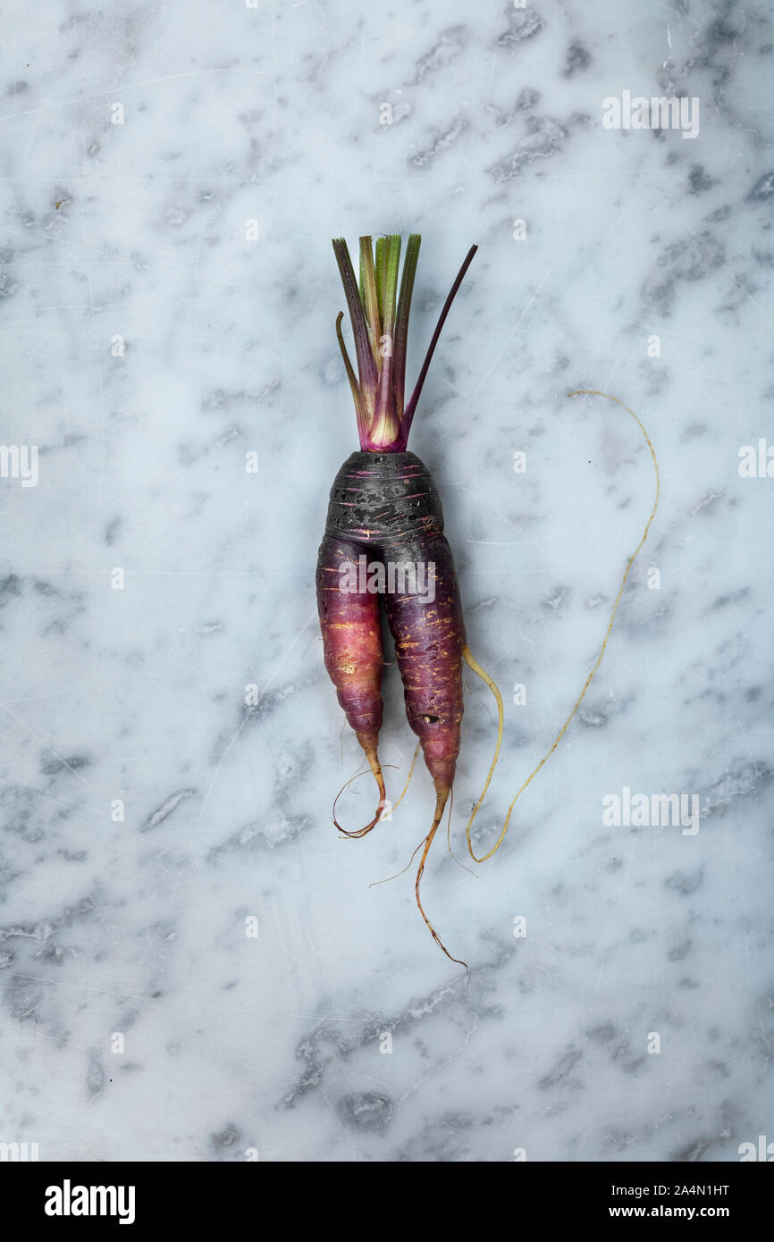 Root vegetable on marble background Stock Photo - Alamy
