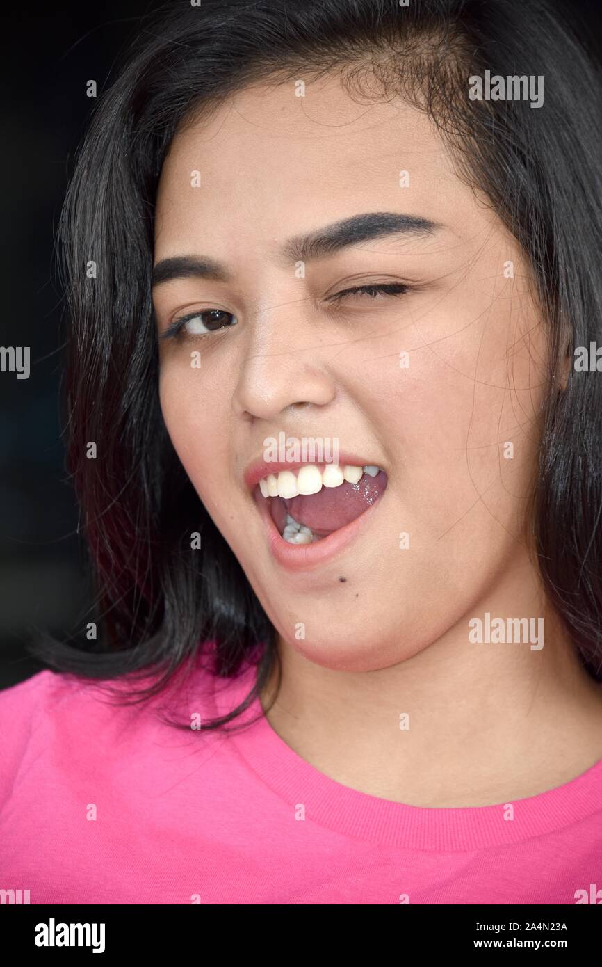 An Attractive Diverse Female Winking Stock Photo - Alamy
