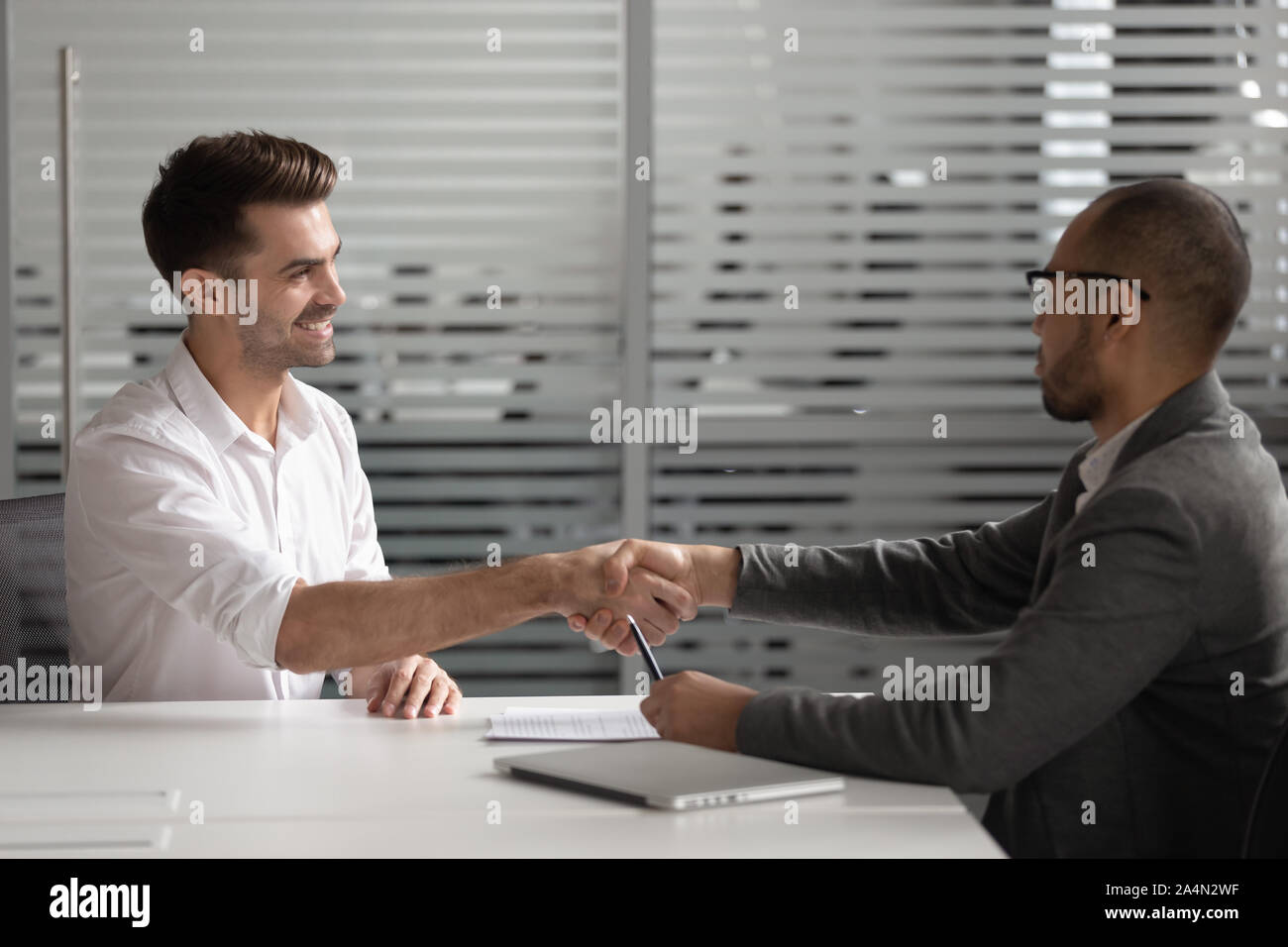 Interview handshake ethnic hi-res stock photography and images - Alamy