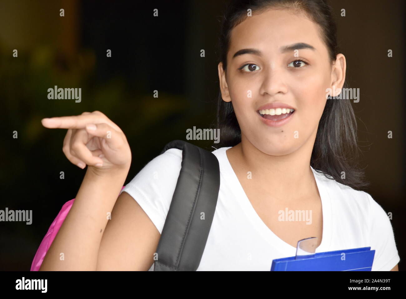 Pointing Cute Minority School Girl Stock Photo - Alamy