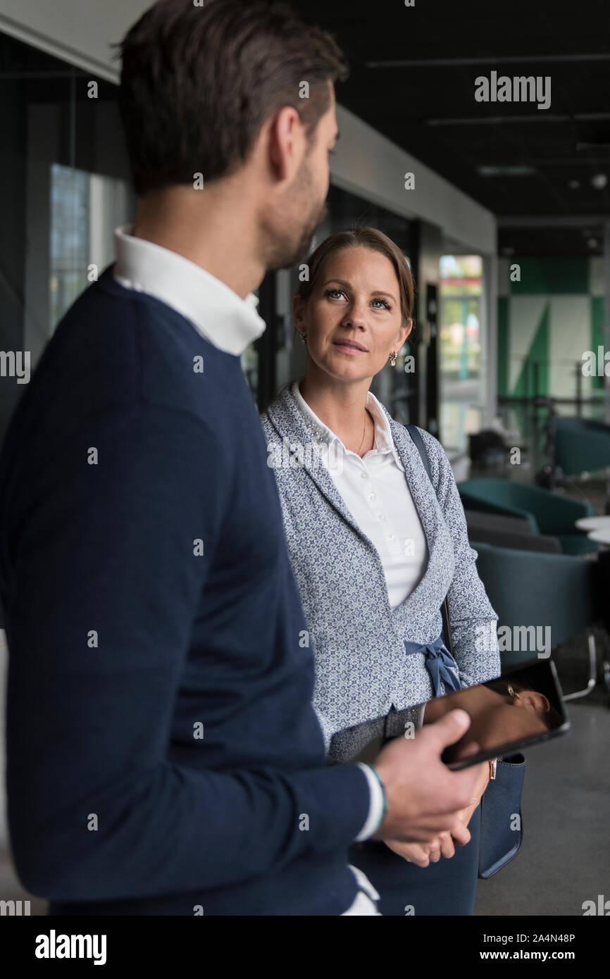 Coworkers in meeting looking digital hi-res stock photography and images - Alamy