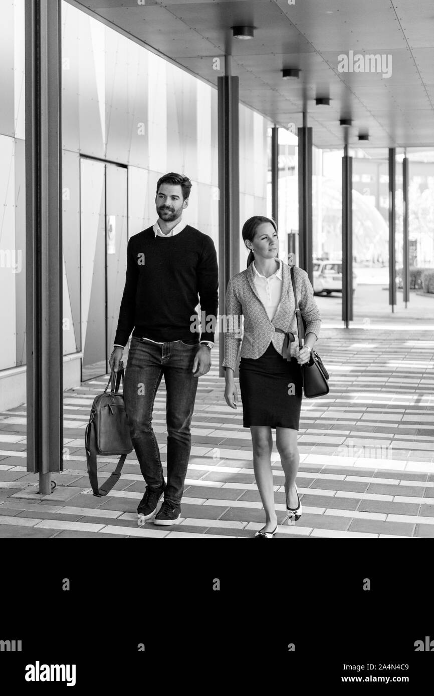 Coworkers in office building Stock Photo - Alamy