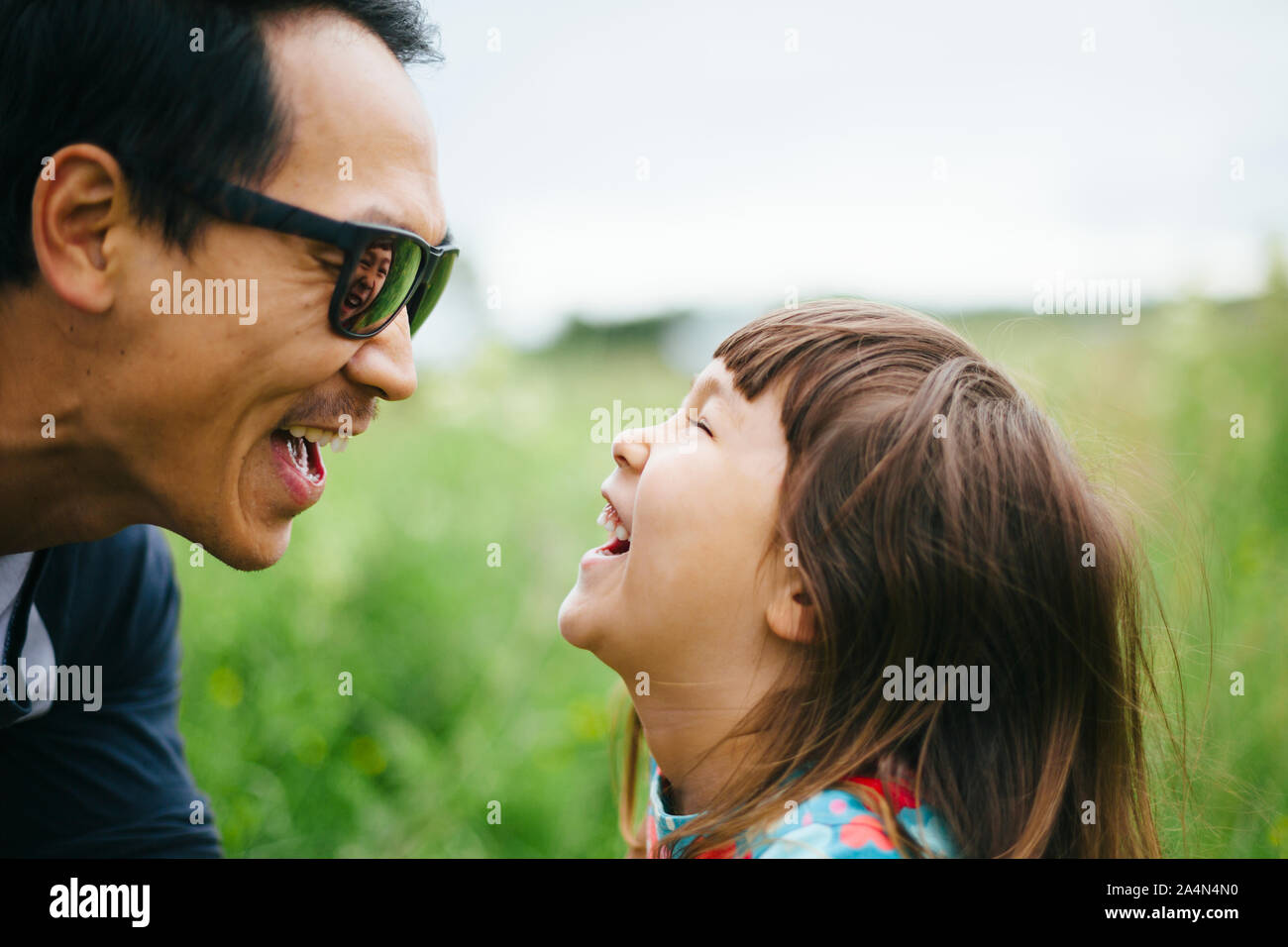 Father and daughter laughing Stock Photo - Alamy