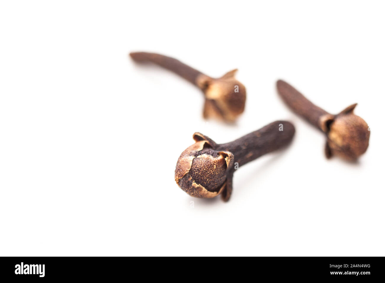 Three cloves isolated on white background Stock Photo - Alamy