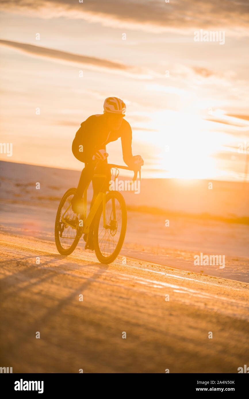 Man looking back cycling hi-res stock photography and images - Alamy