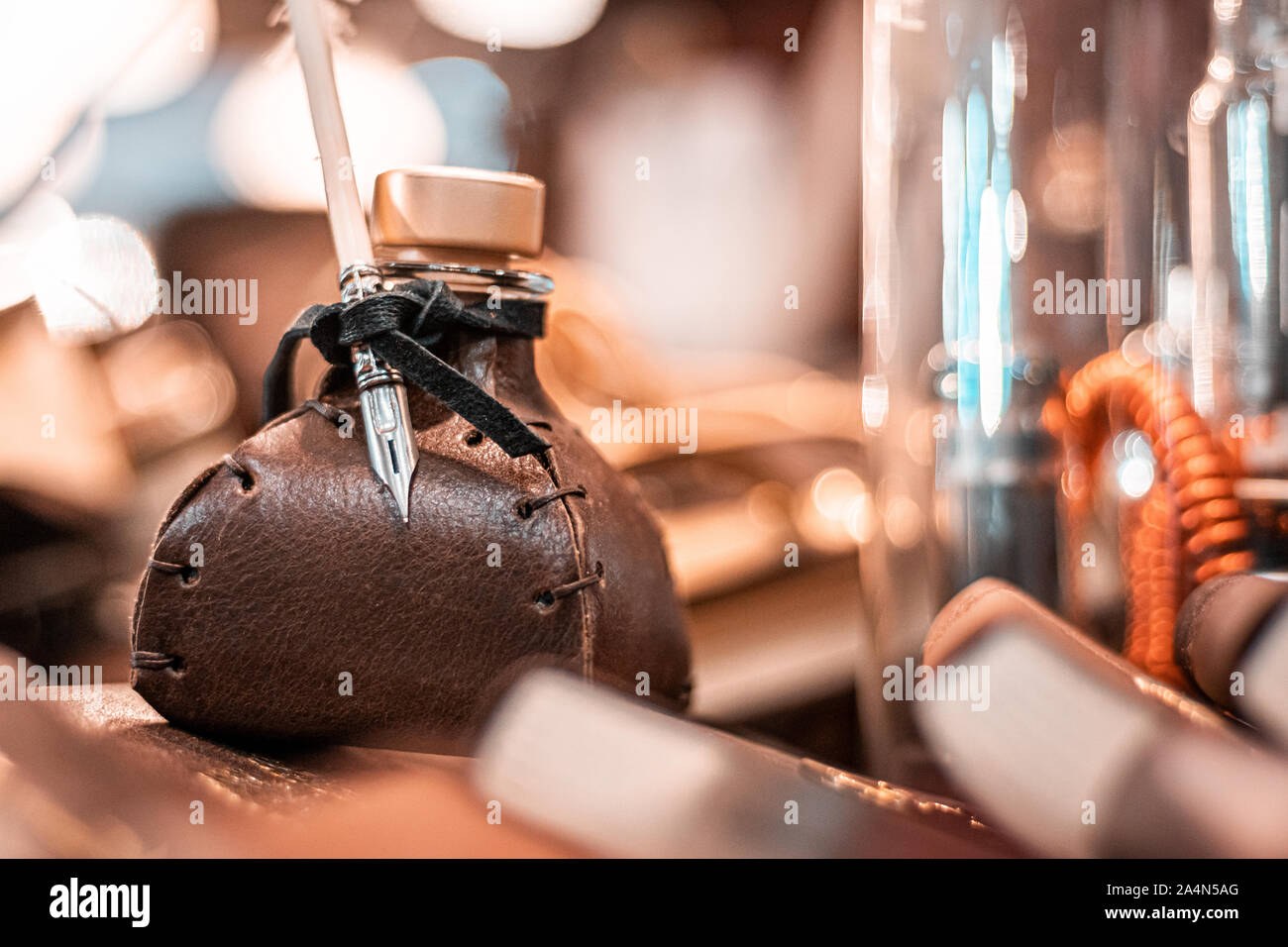 Victorian and steampunk inspired writing set. Old inkwell and quill pen ...