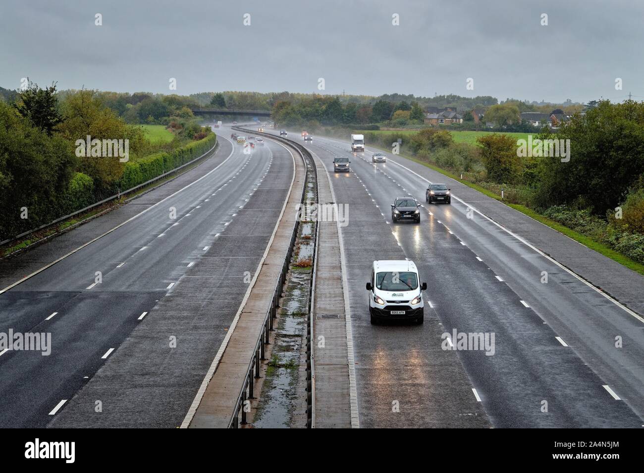 An elevated view of traffic the M3 Motorway near Shepperton on a dull ...