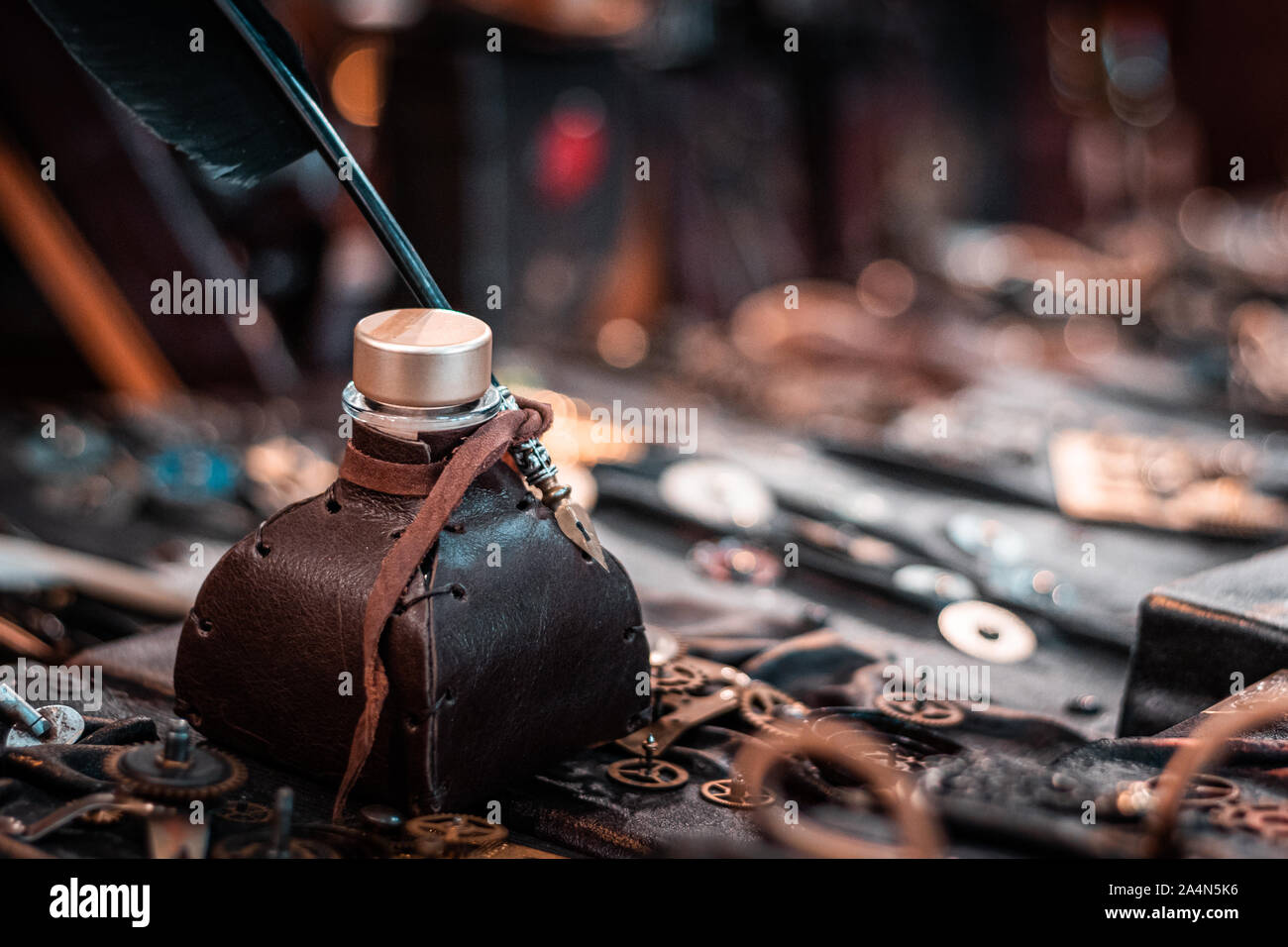 Victorian and steampunk inspired writing set. Old inkwell and quill pen ...
