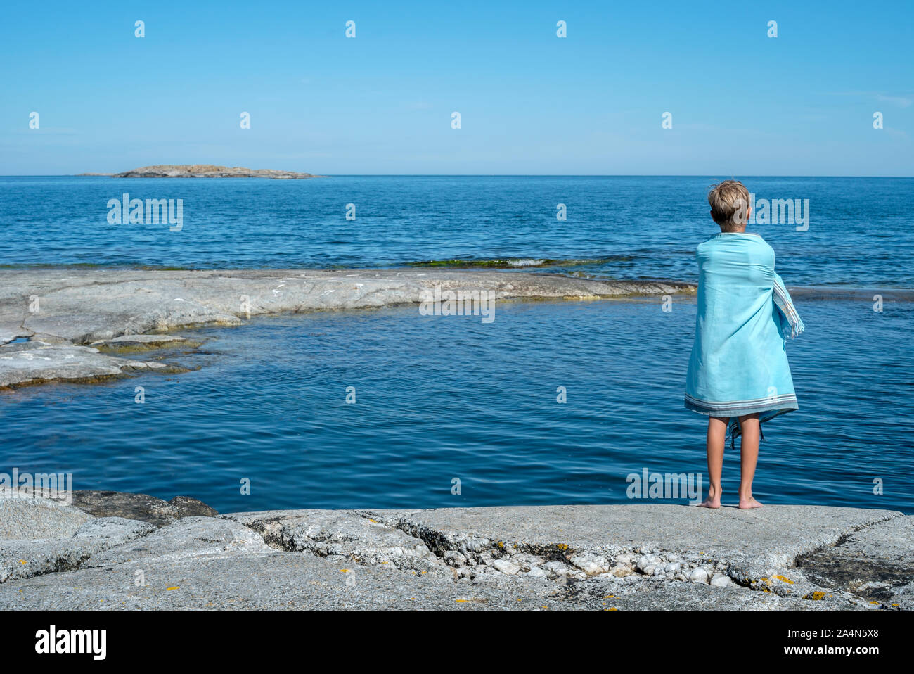 Boy at sea Stock Photo - Alamy