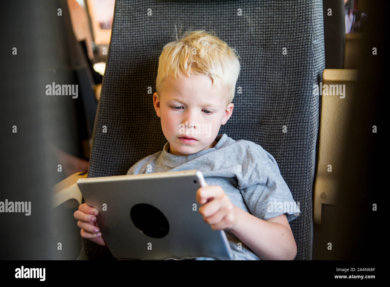 Boy using digital tablet Stock Photo - Alamy