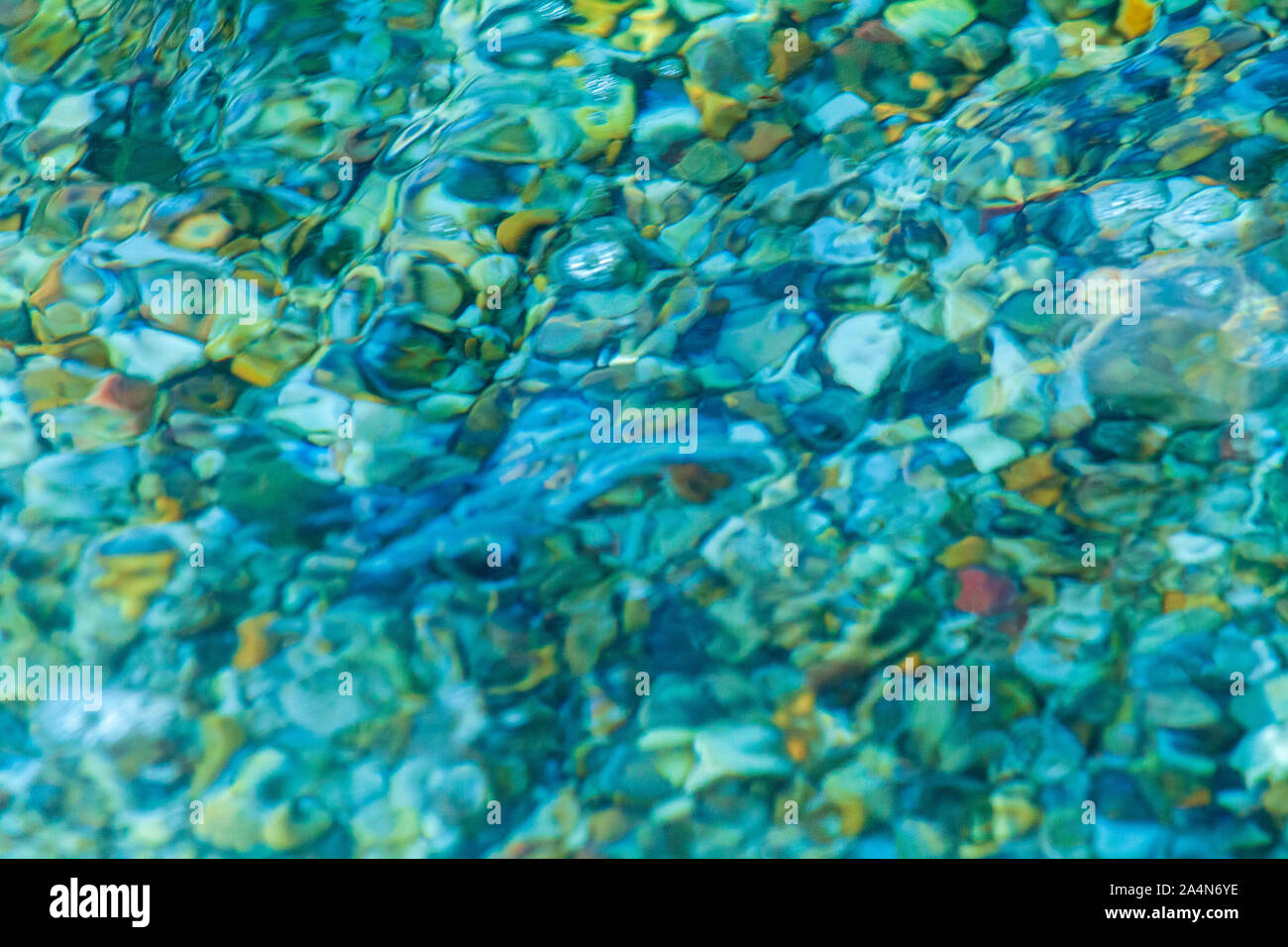 sea pebbles colored granite on the beach background stones. The shore ...