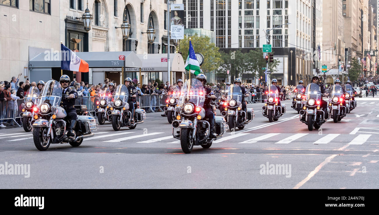 New York, NY, USA - October 14, 2019: Police officers ride bikes along ...
