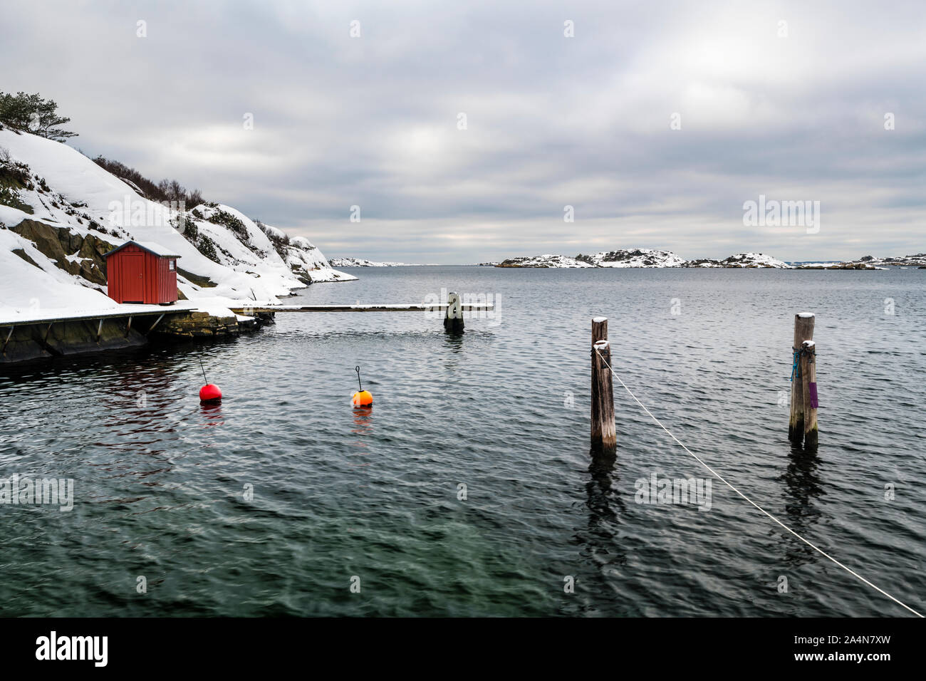 Red cottage by sea Stock Photo - Alamy