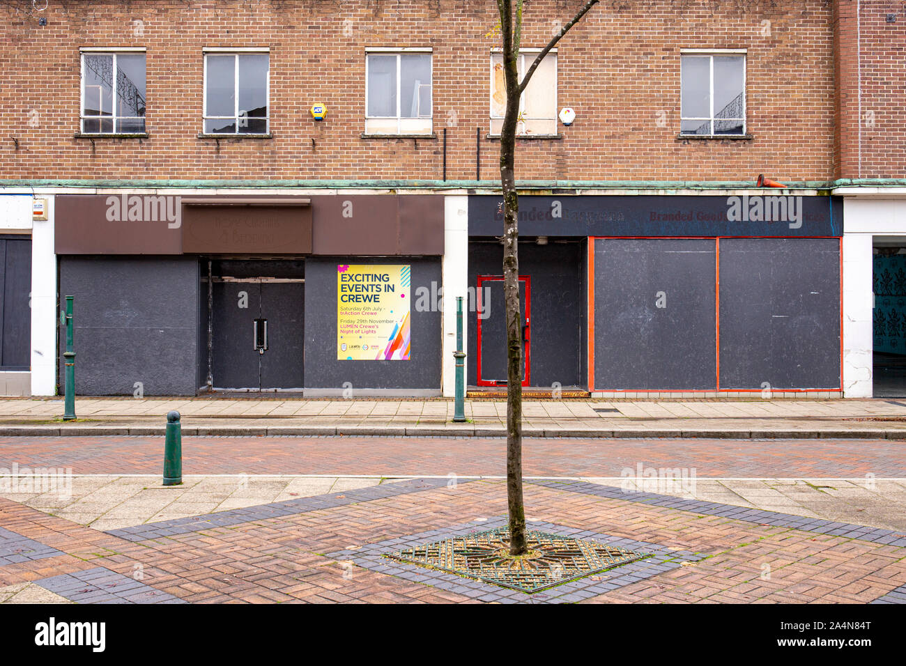Poster saying Exciting events in Crewe on boarded up and closed down ...
