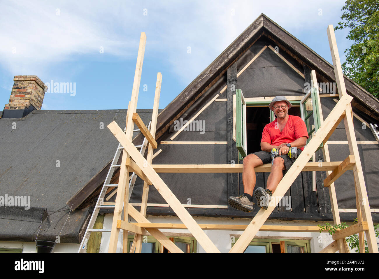 Man renovating house Stock Photo - Alamy